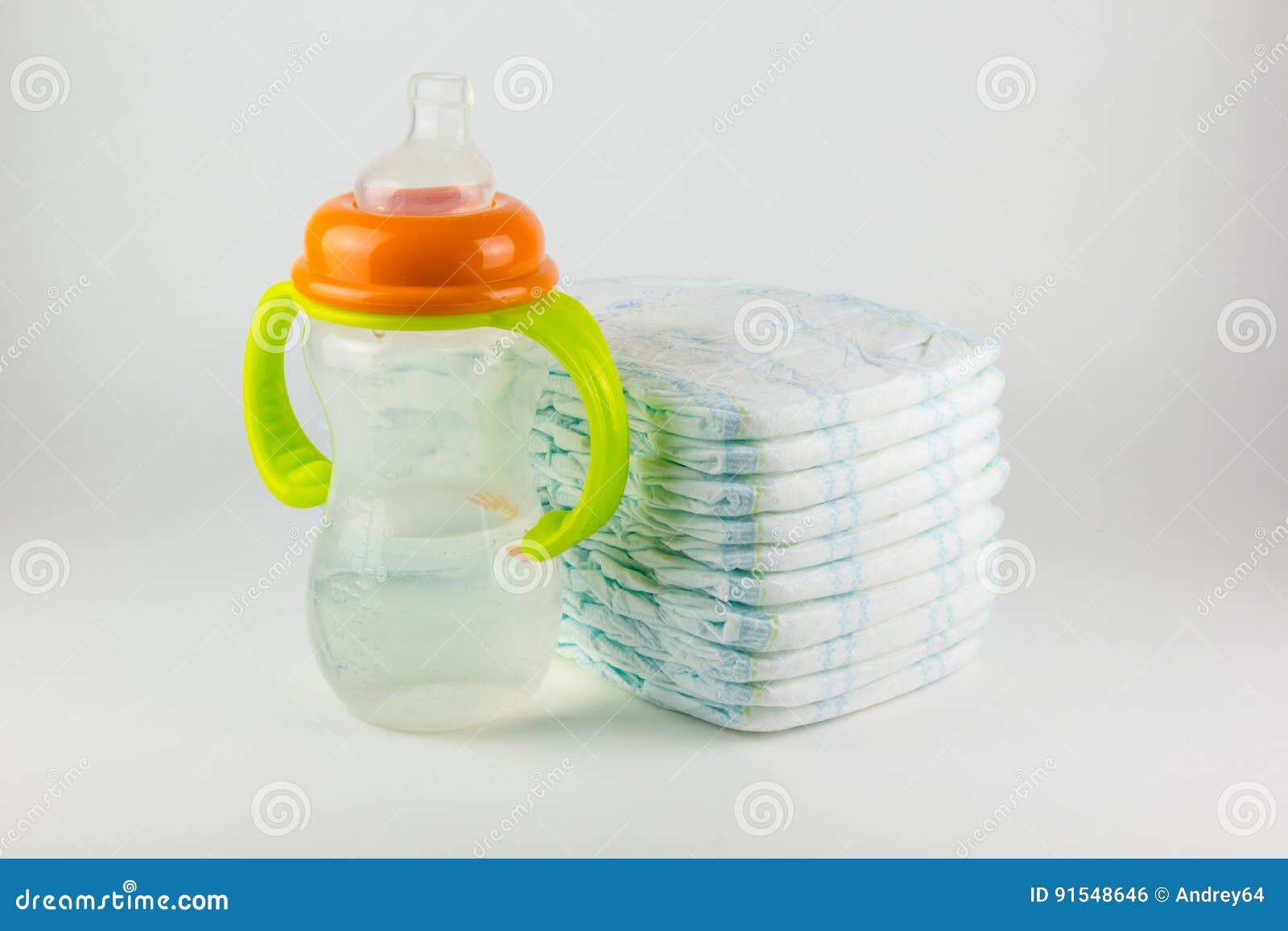Baby Diapers and Bottle on a White Background Stock Photo - Image of ...