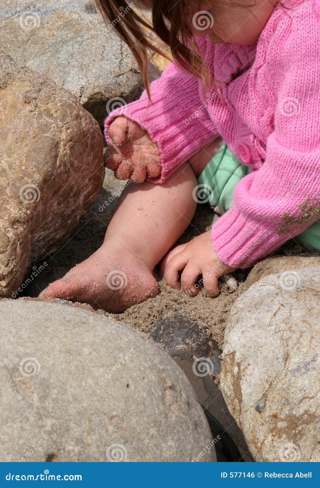 Baby Digging in the Sand stock photo. Image of childhood - 577146