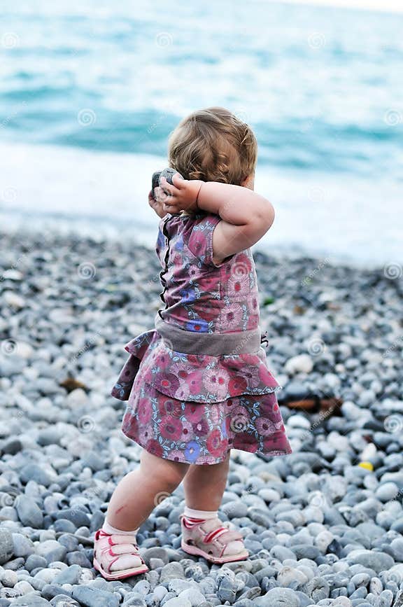 Baby dropping pebble stock image. Image of outdoors, healthy - 14744459