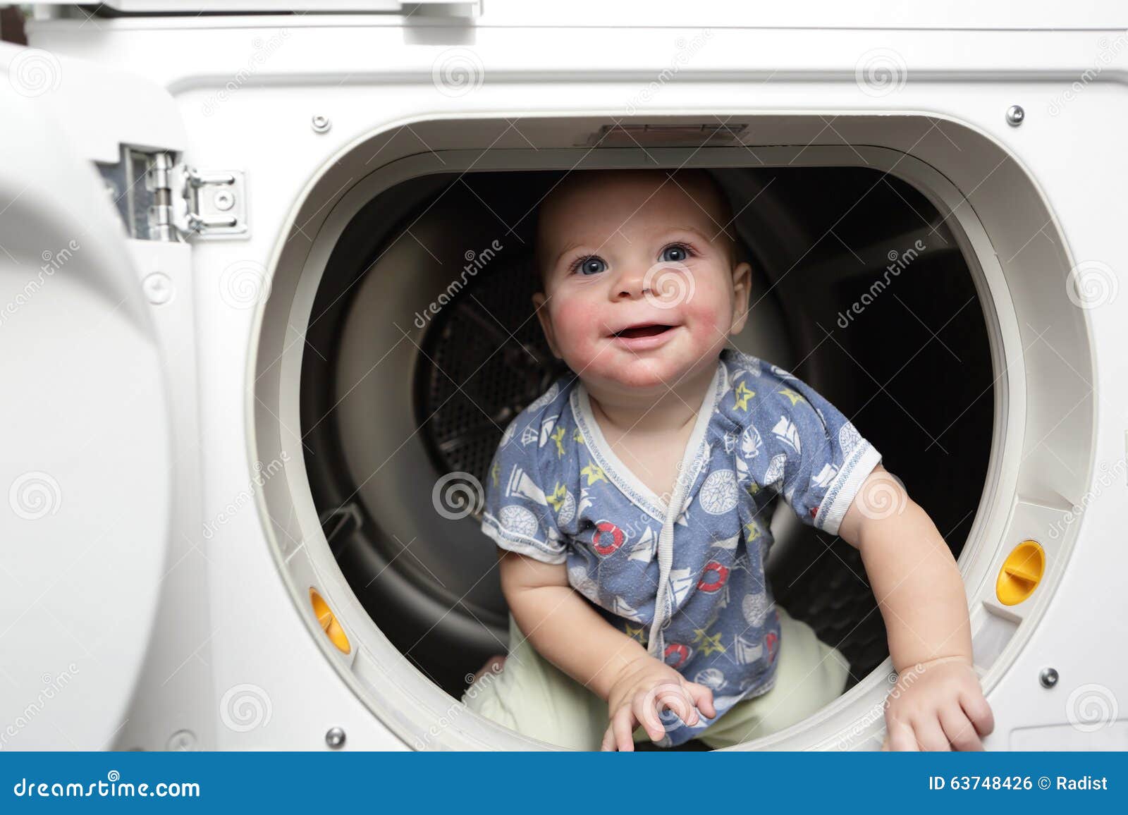 Baby in the dryer stock photo. Image of baby, emotion - 63748426