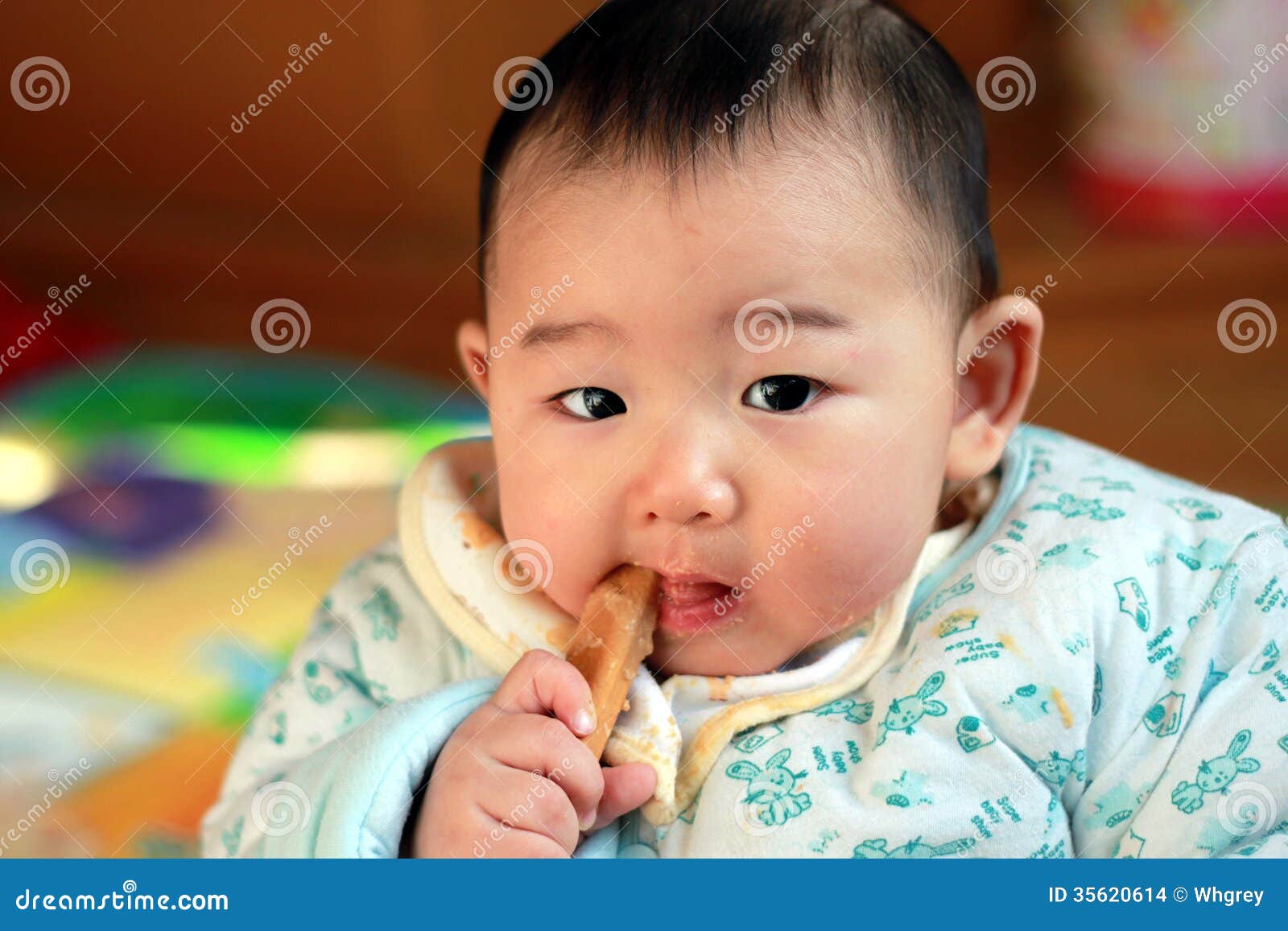 Baby eat premolar stickt stock photo. Image of healthy - 35620614