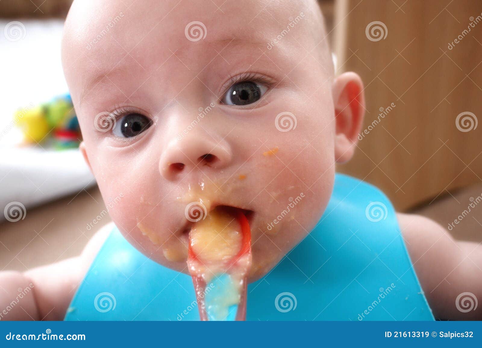 A baby eating stock image. Image of feeding, messy, food - 21613319
