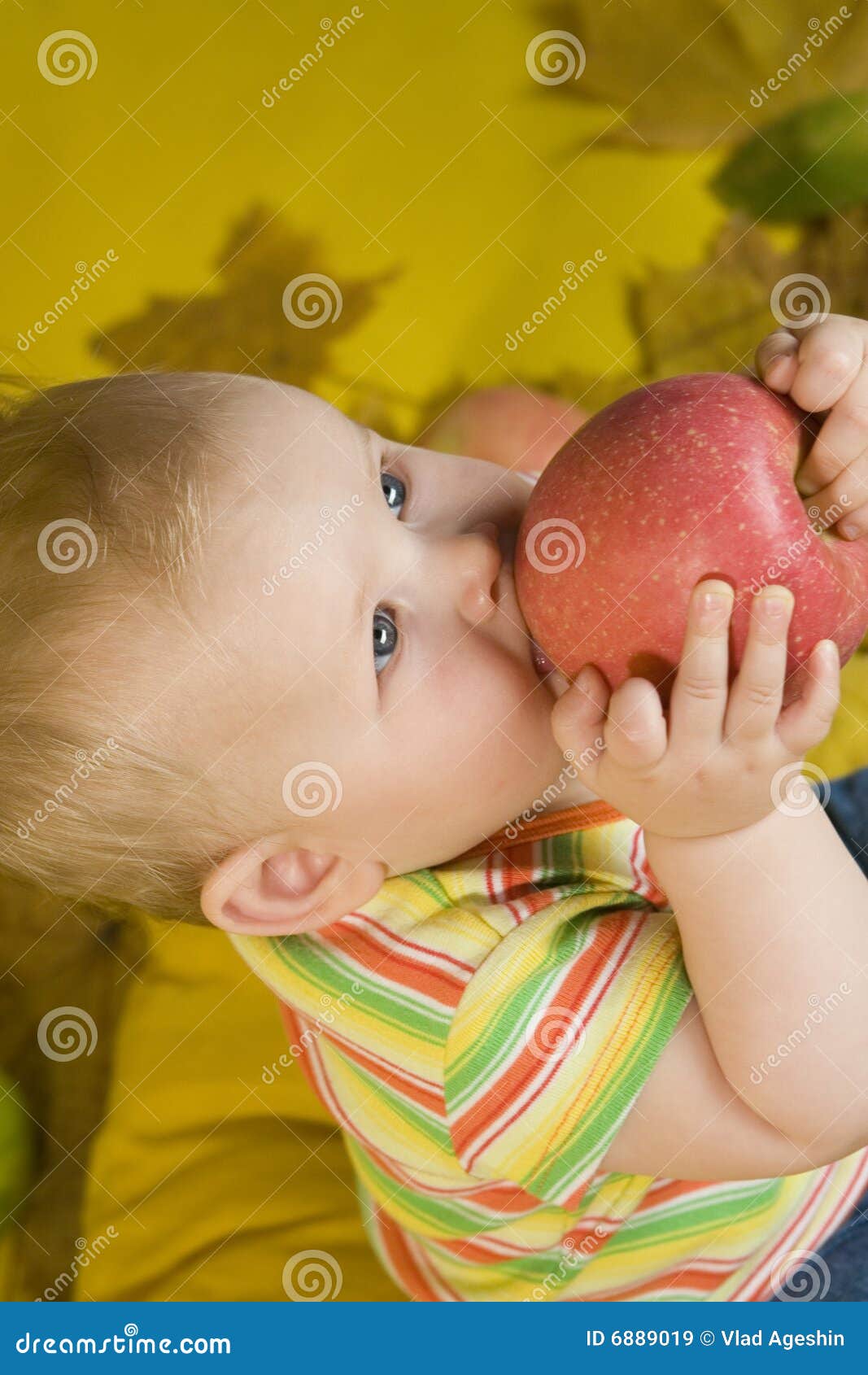Baby eating apple stock image. Image of people, beauty - 6889019