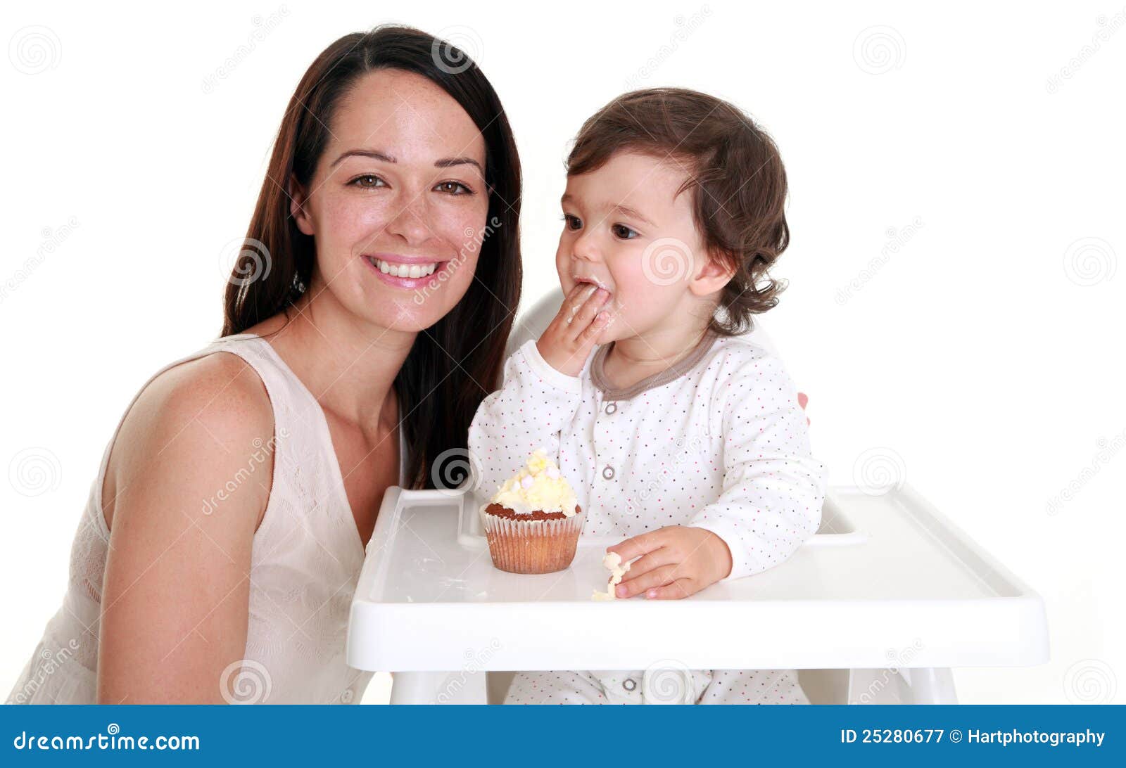 Baby eating cake with mum stock image. Image of eating - 25280677