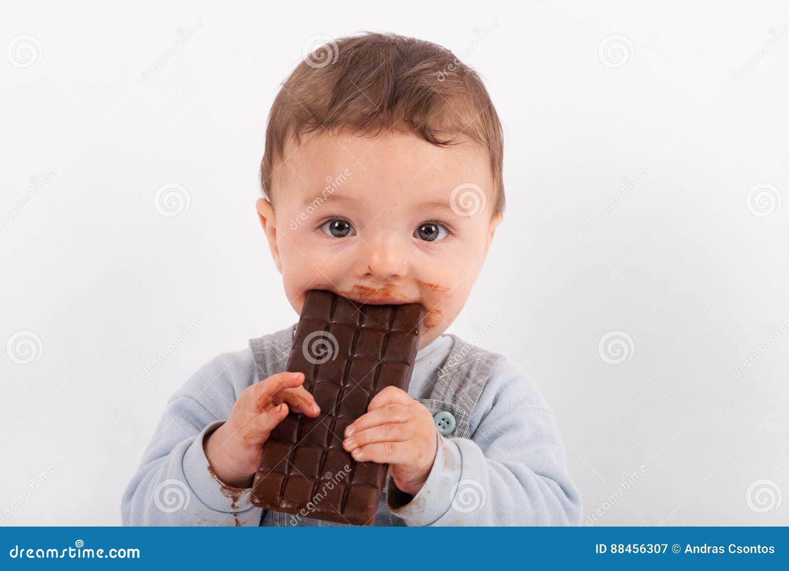 Baby eating chocolate stock image. Image of white, baby - 88456307