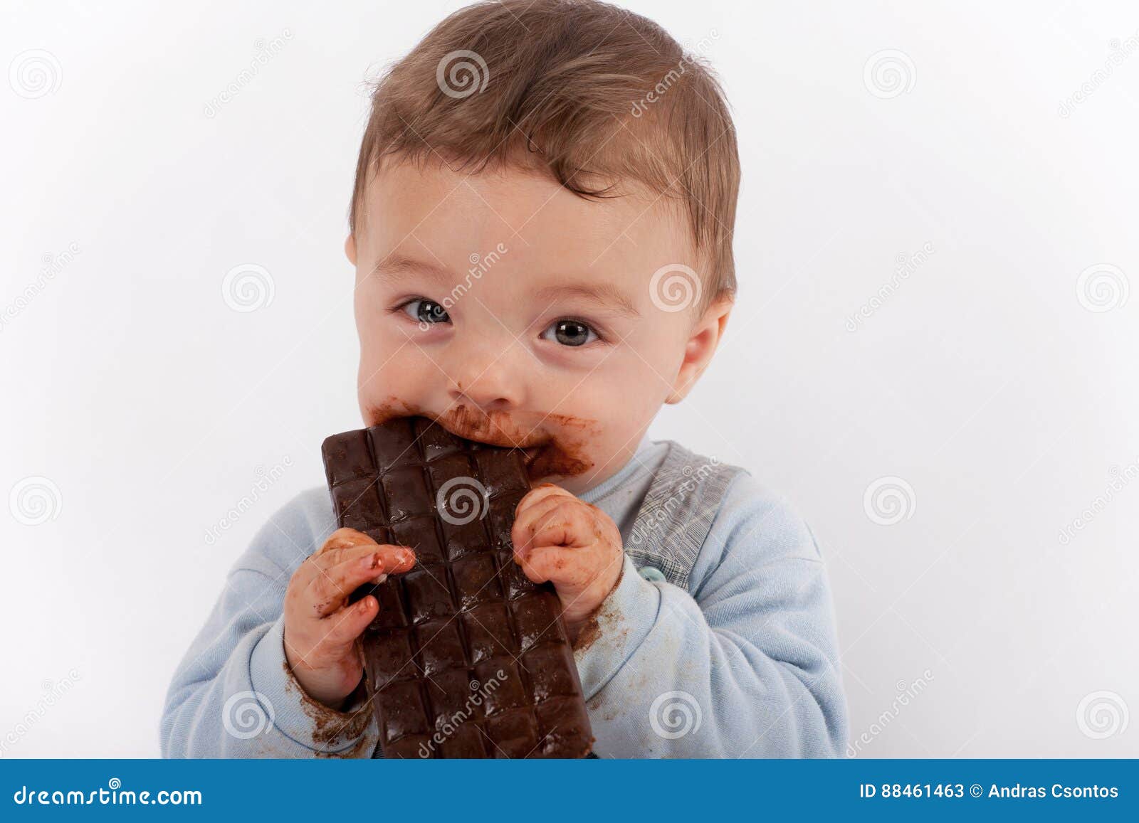 Baby eating chocolate stock image. Image of tasty, white - 88461463