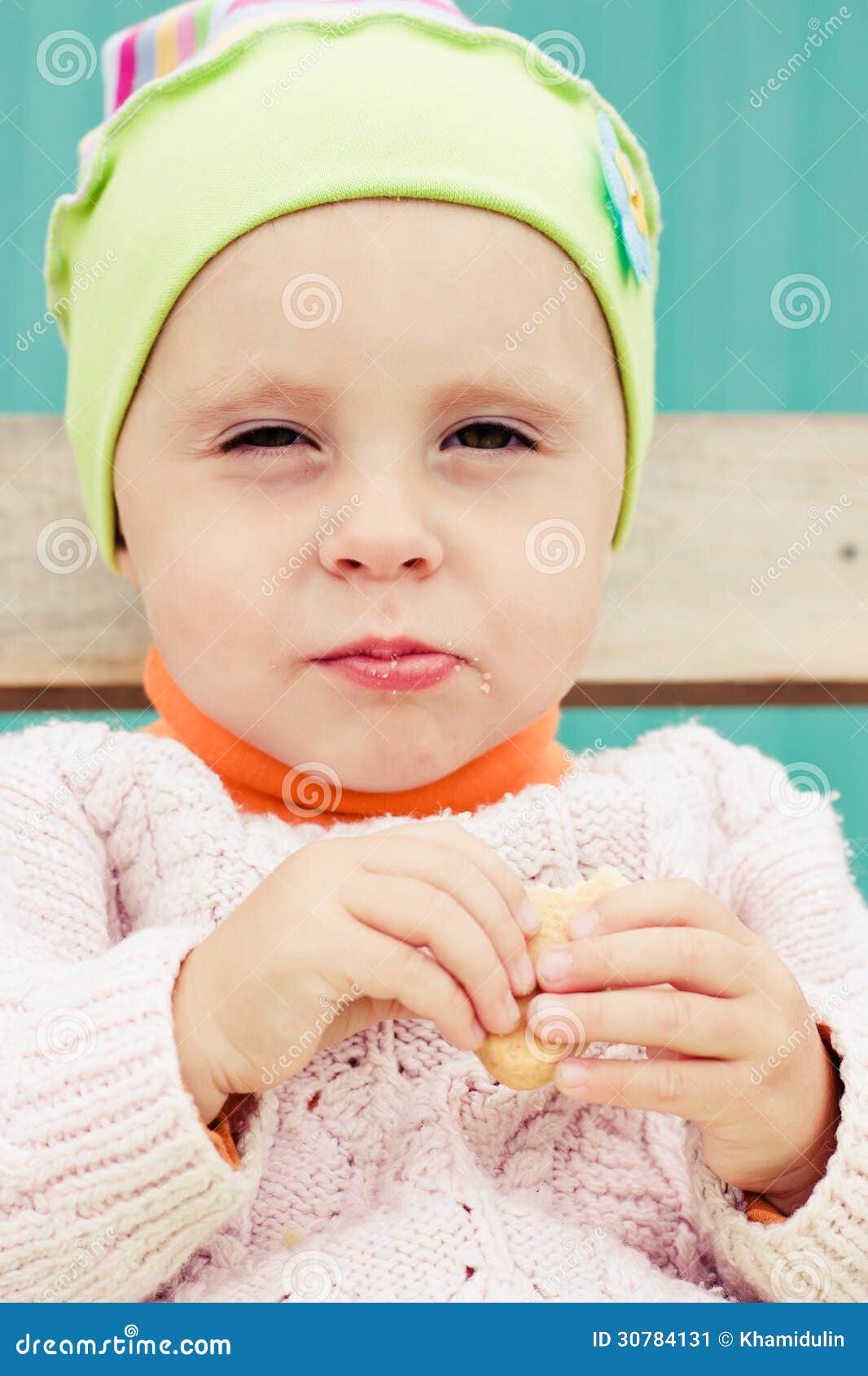 Baby eating a cracker. stock image. Image of biscuit - 30784131