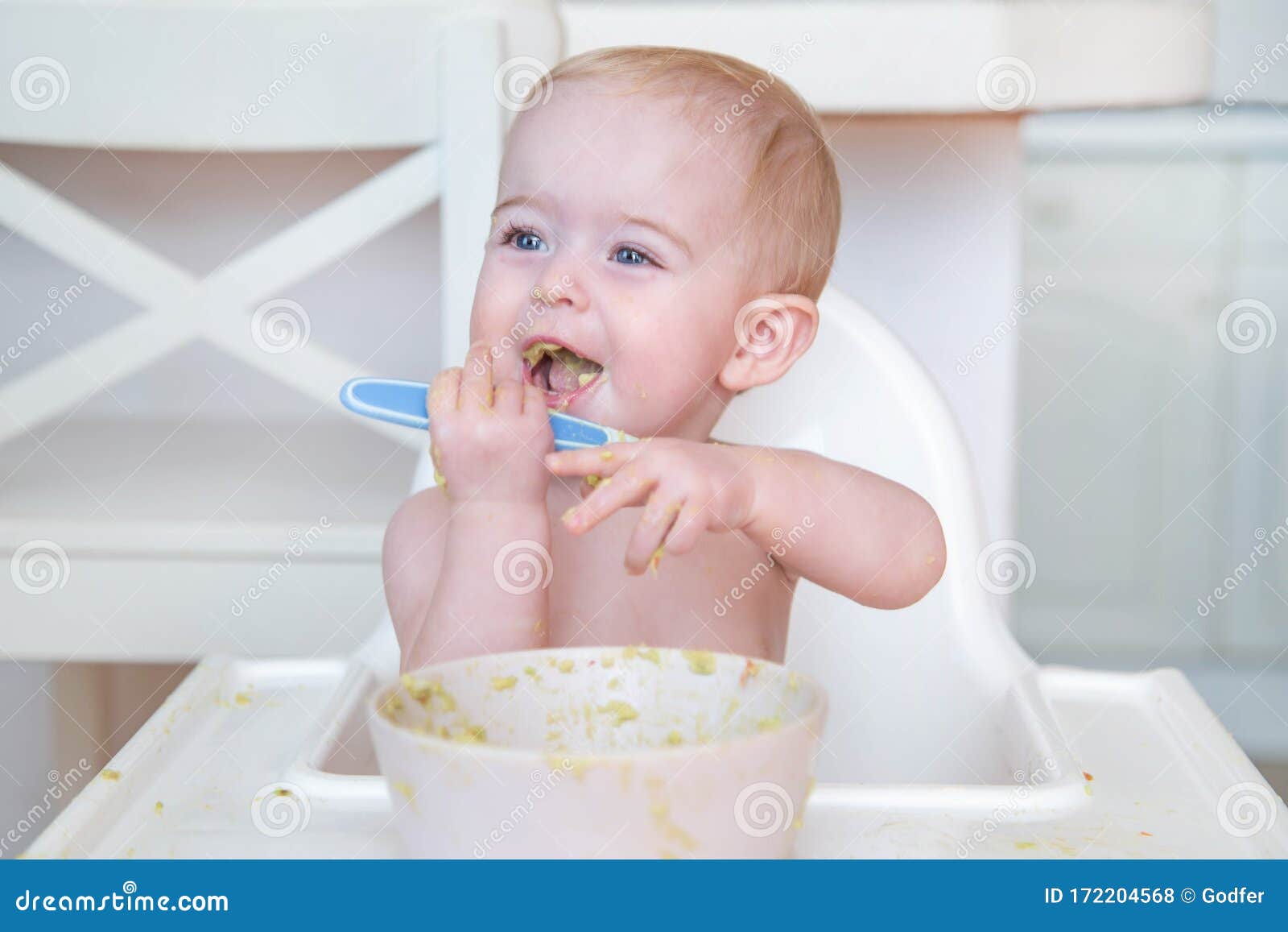 Baby Eating First Solid Food Stock Photo - Image of foods, solids ...