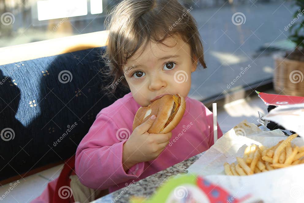 Baby eating hamburger stock photo. Image of beef, food - 9797444