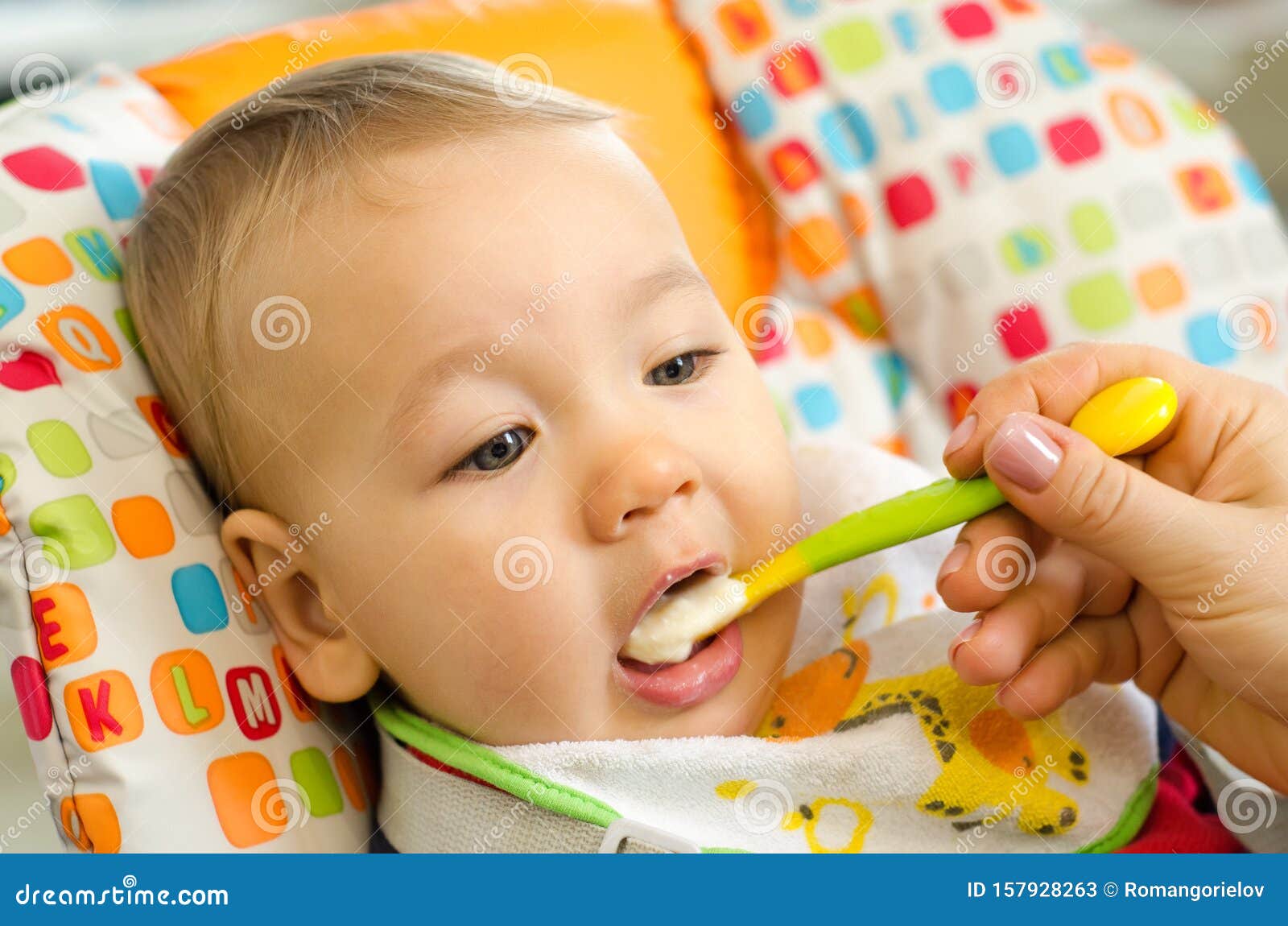 Baby eating stock image. Image of hungry, meal, dinner - 157928263