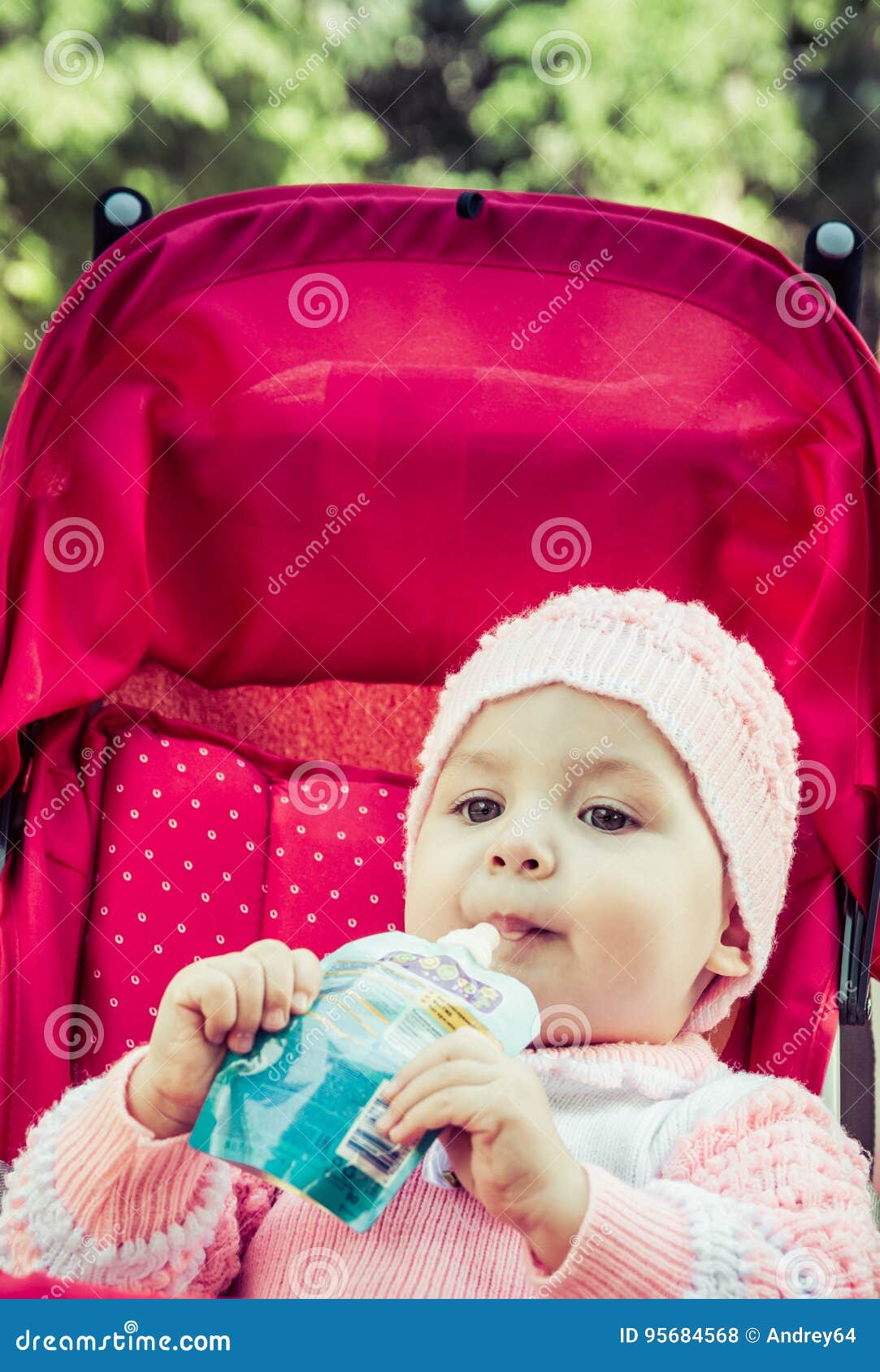 The Baby Eats a Puree from a Supermarket Stock Photo - Image of ...