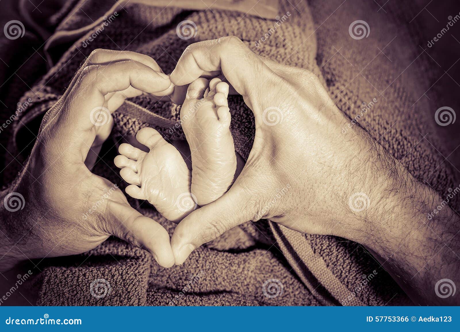 Baby feet in father hands stock photo. Image of cute - 57753366
