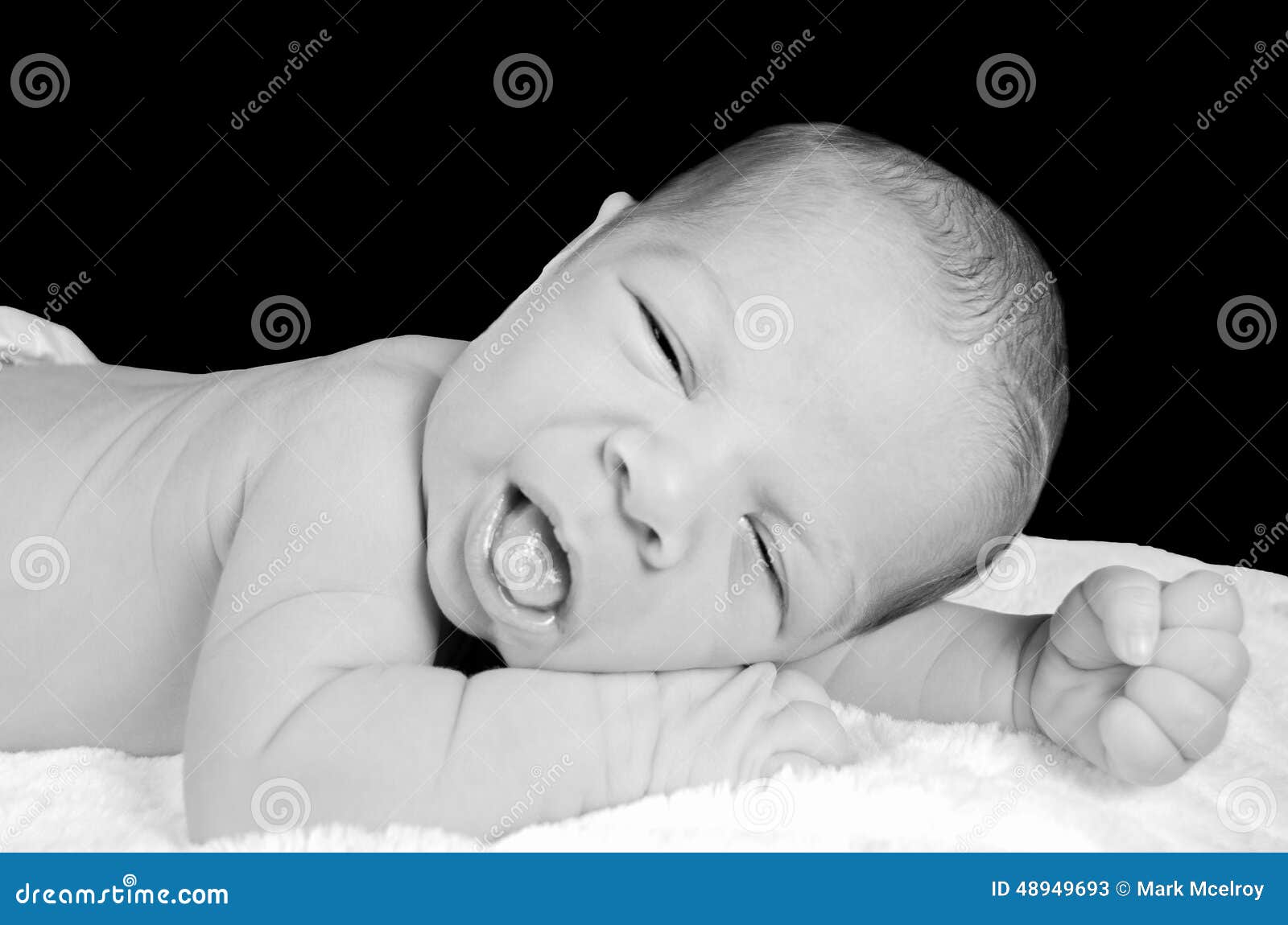Baby Funny face with fist stock image. Image of months - 48949693