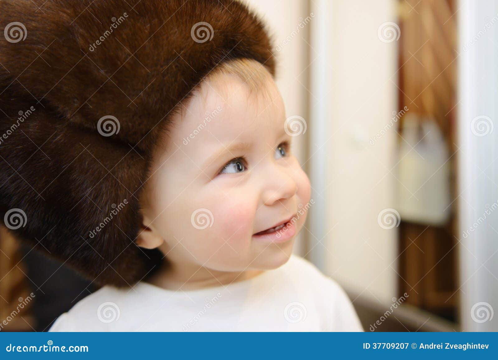 Baby in Fur Cap stock image. Image of child, cheerful - 37709207