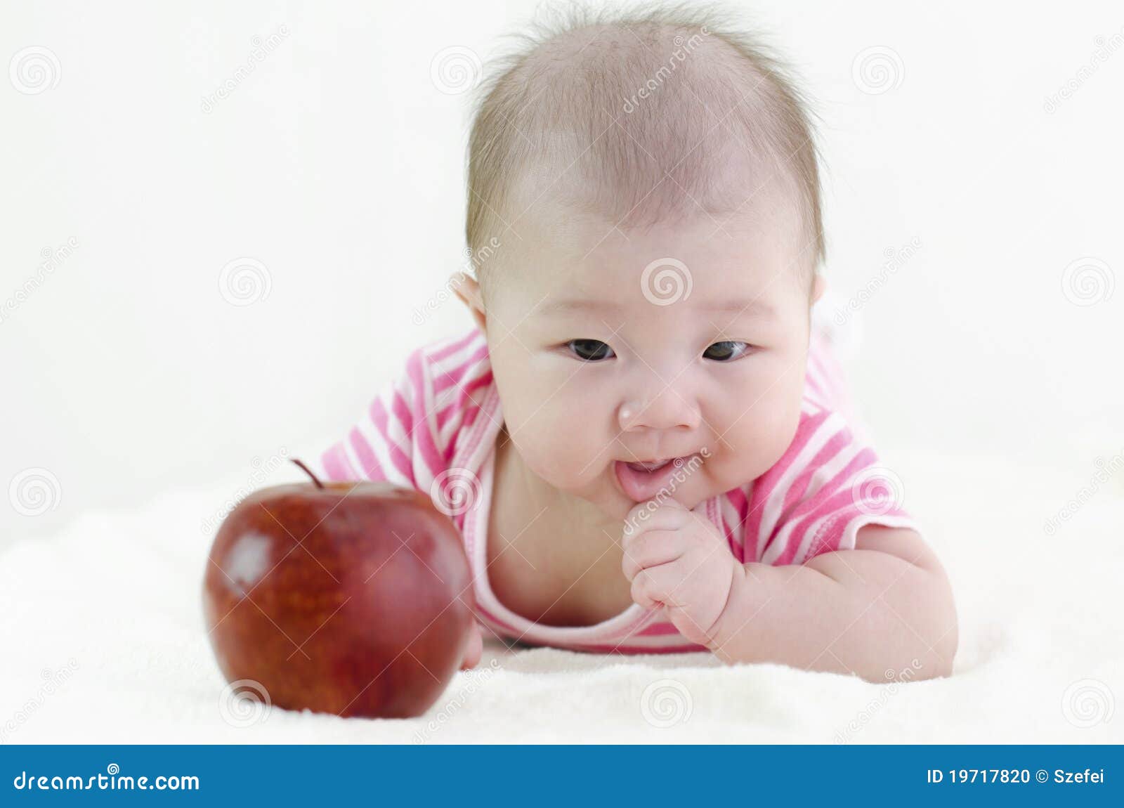 Baby girl with an apple stock photo. Image of asian, diversity - 19717820