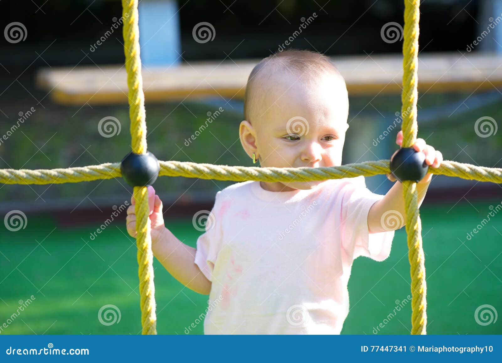 Baby Girl Behind a Rope Net Stock Image - Image of emotion, baby: 77447341