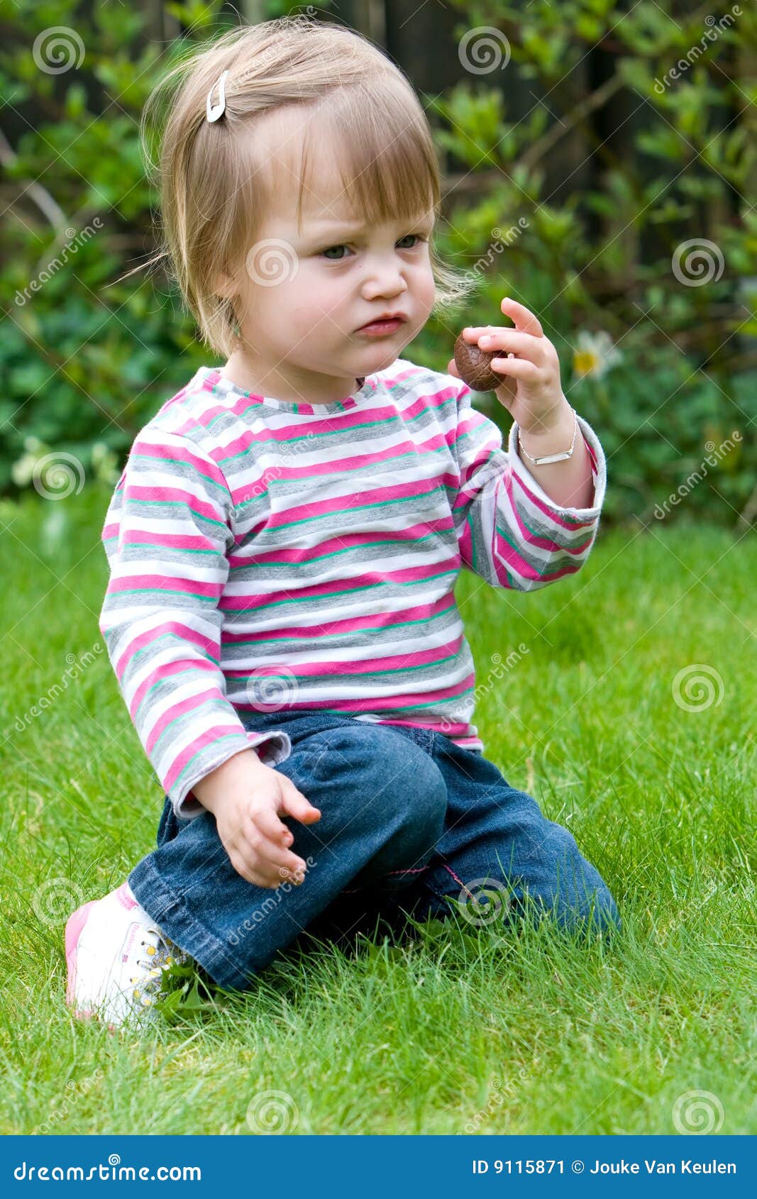 Baby girl is eating candy stock image. Image of innocent - 9115871
