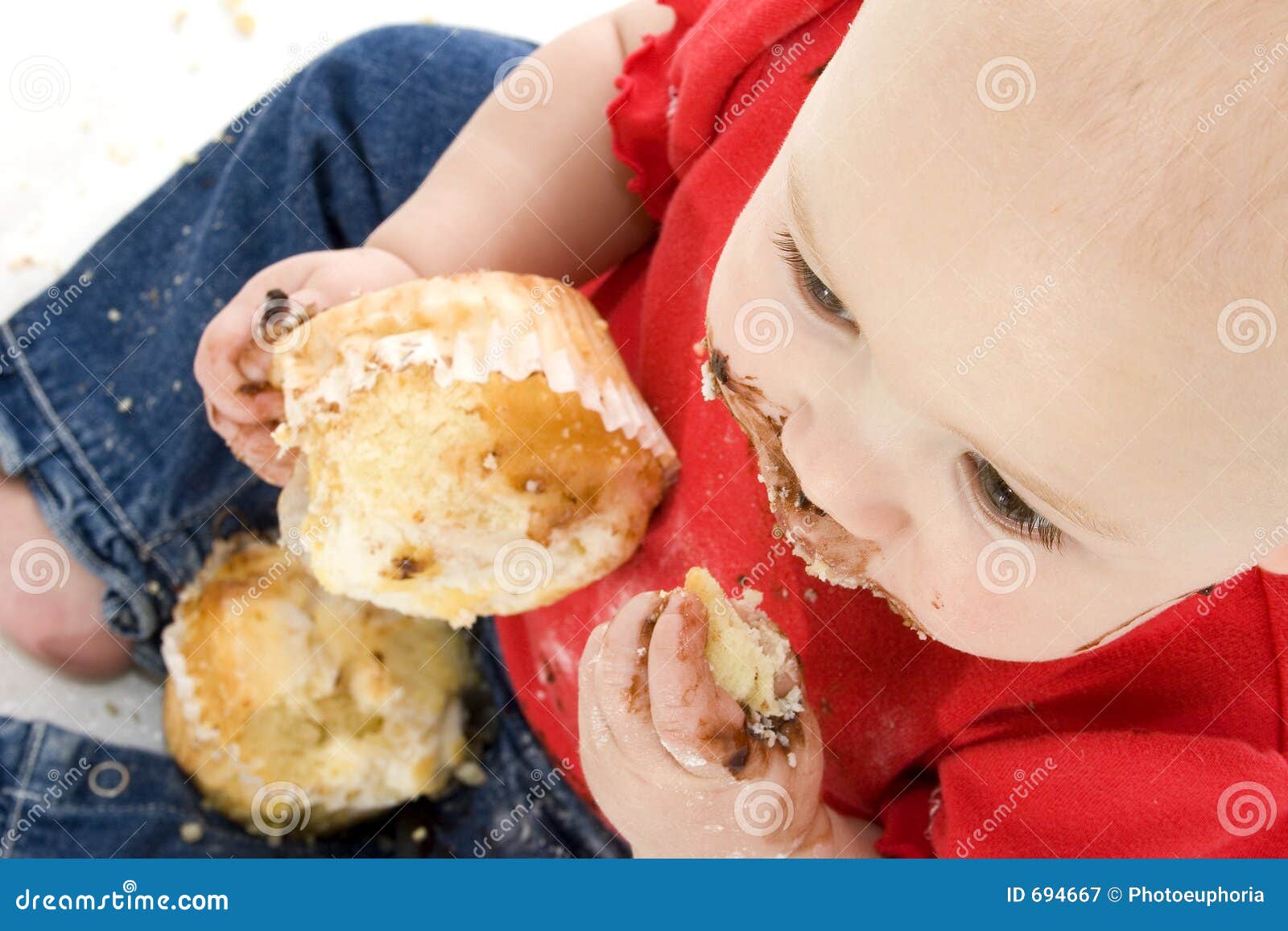 Baby Girl Eating Muffins stock image. Image of head, sitting - 694667