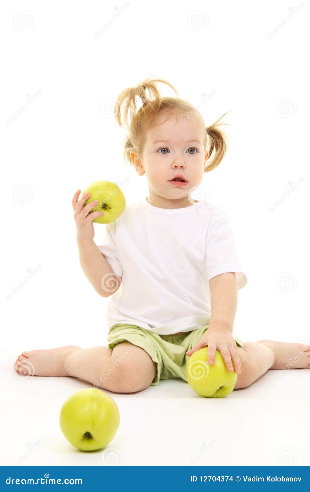 Baby Girl with Green Apples Stock Photo - Image of child, fruit: 12704374