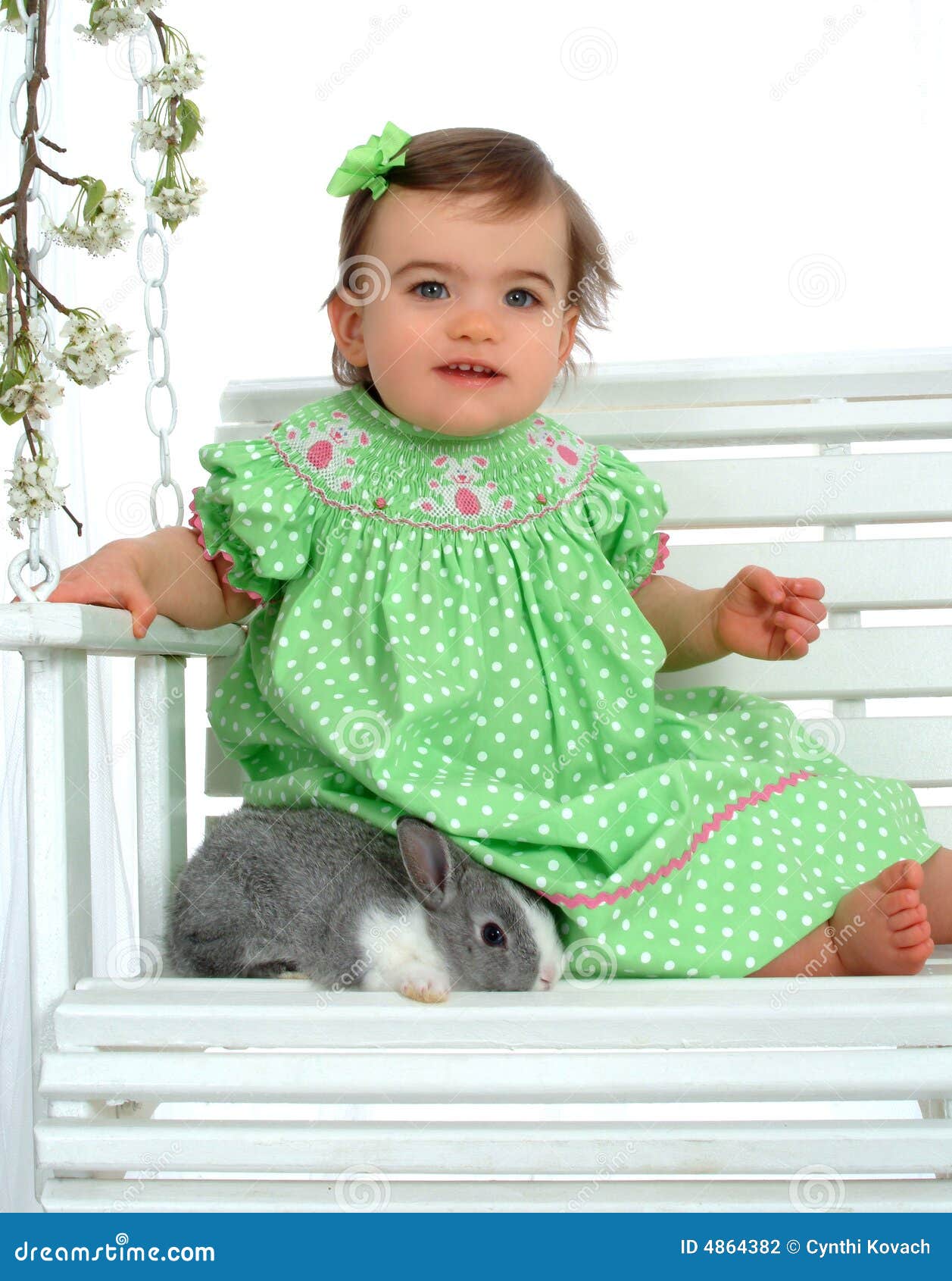 Baby Girl in Green and Bunny Stock Photo - Image of delightful, hares ...