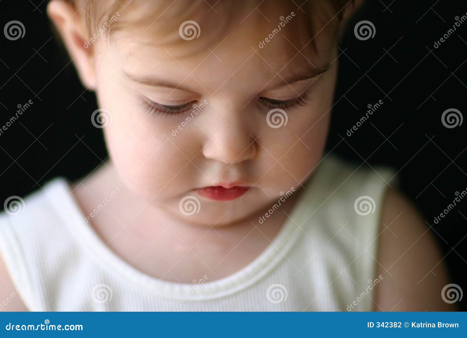 Baby Girl Looking Down stock photo. Image of teen, baby - 342382