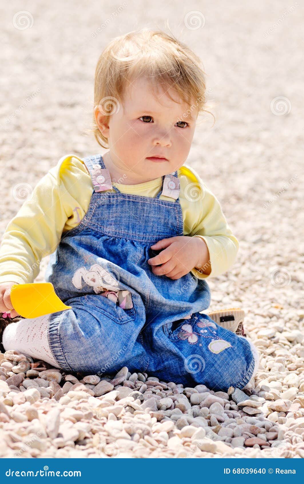 Baby girl on pebble stock photo. Image of caucasian, child - 68039640