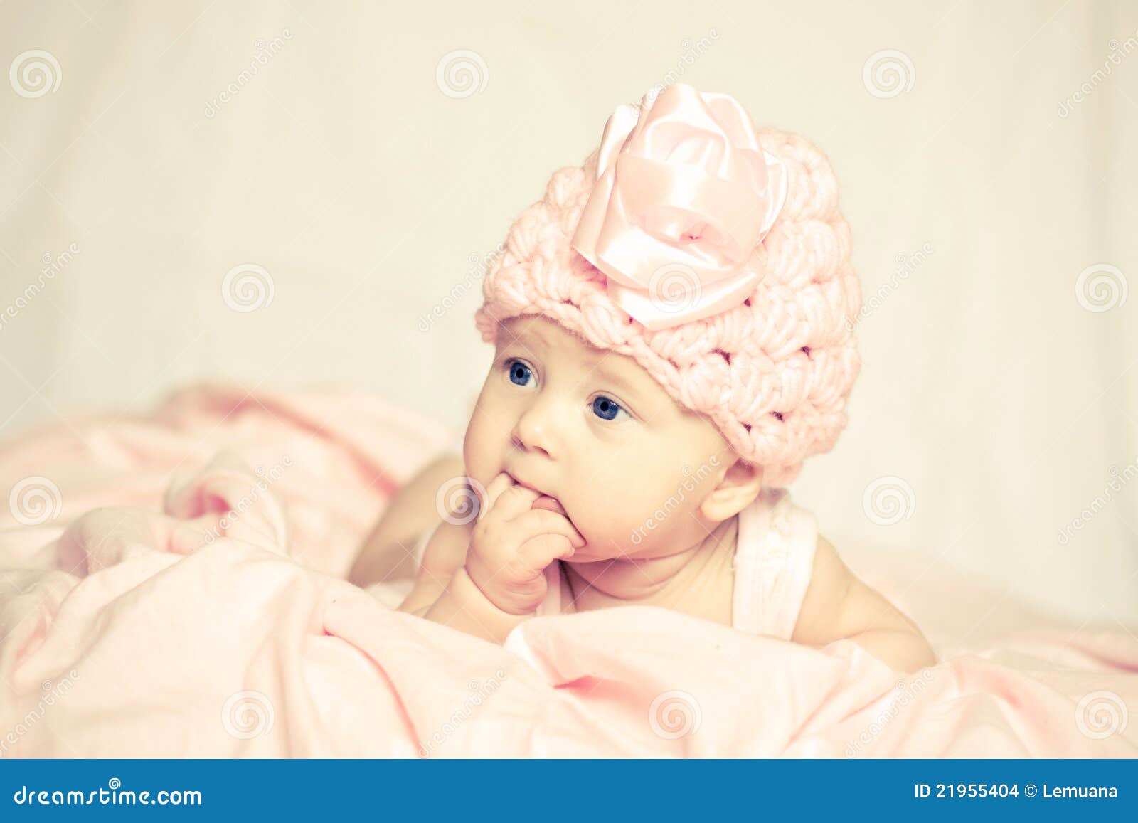 Baby girl in a pink hat stock photo. Image of close, innocent - 21955404