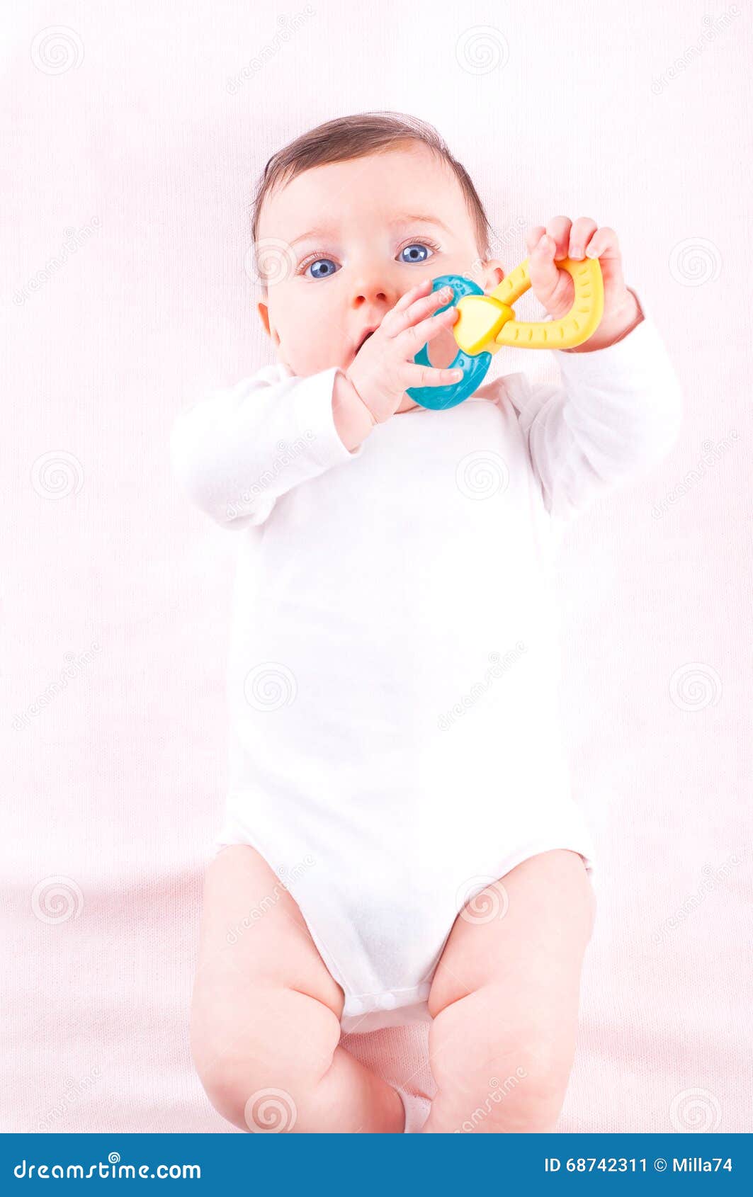 Baby Girl with Rattle Teether Toy. Stock Image - Image of family ...