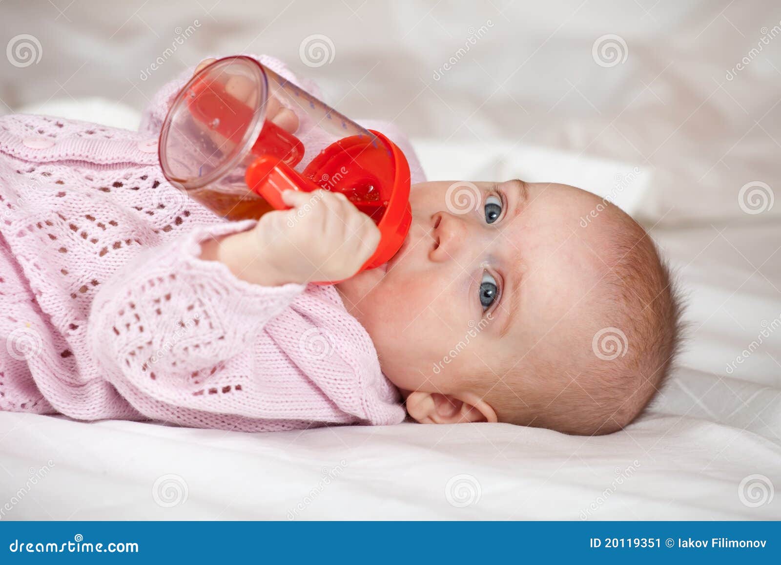 Baby girl with sippy cup stock image. Image of child - 20119351