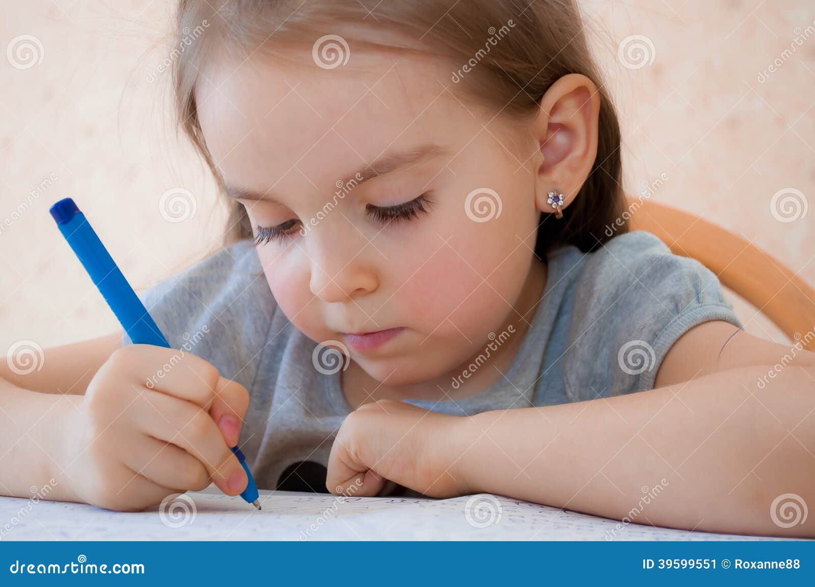 Baby Girl Sitting Writing at the Table Stock Image - Image of childhood ...