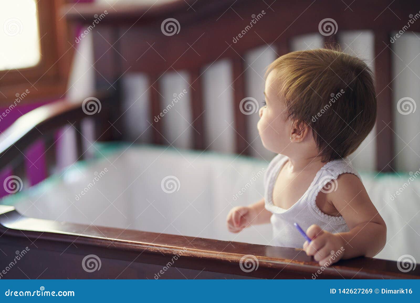 Baby Girl Looking at Window Stock Image - Image of sweet, light: 142627269