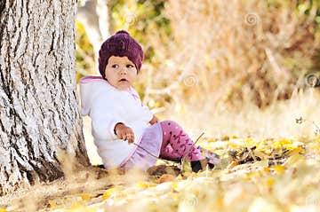 Baby girl under the tree stock image. Image of forest - 28557435