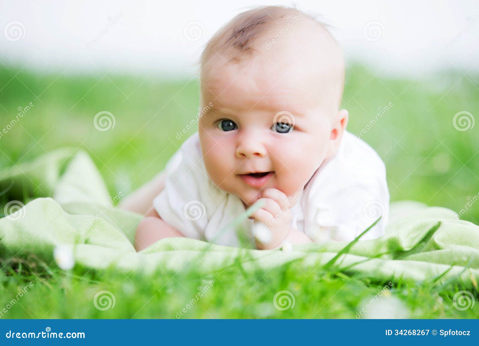 Baby on the grass stock image. Image of garden, head - 34268267