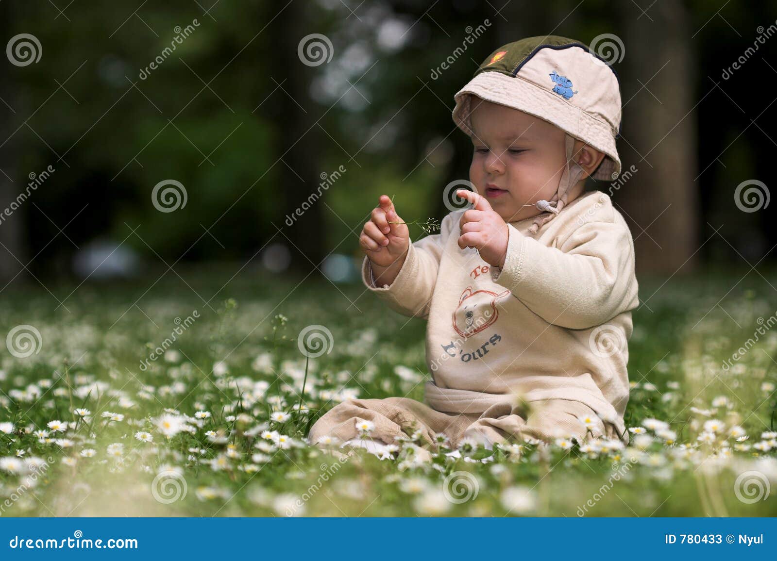 Baby on the green field 7. stock image. Image of face, kids - 780433
