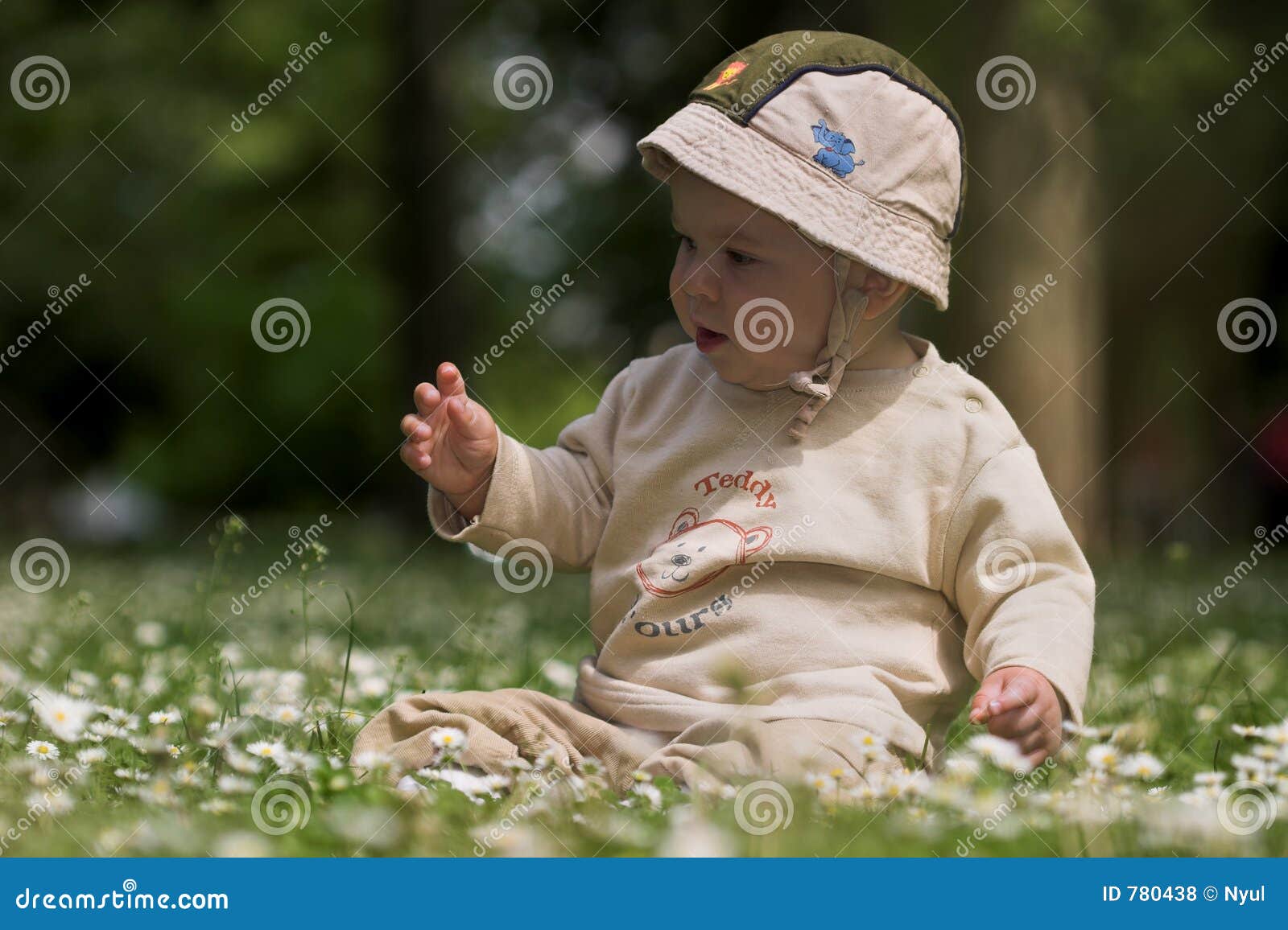 Baby on the green field 8. stock photo. Image of family - 780438