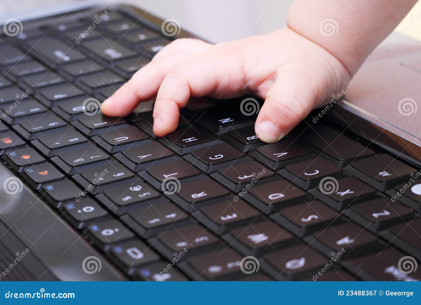 Baby Hand on Keyboard Laptop Stock Image - Image of hand, concept: 23488367