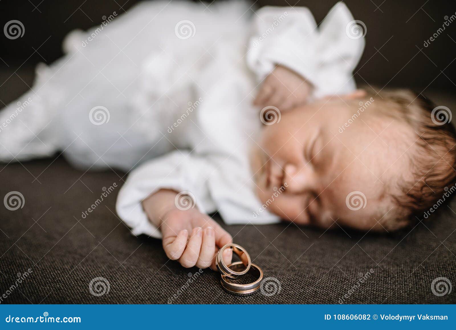 Baby Hand Holding Gold Wedding Ring Stock Photo - Image of father ...