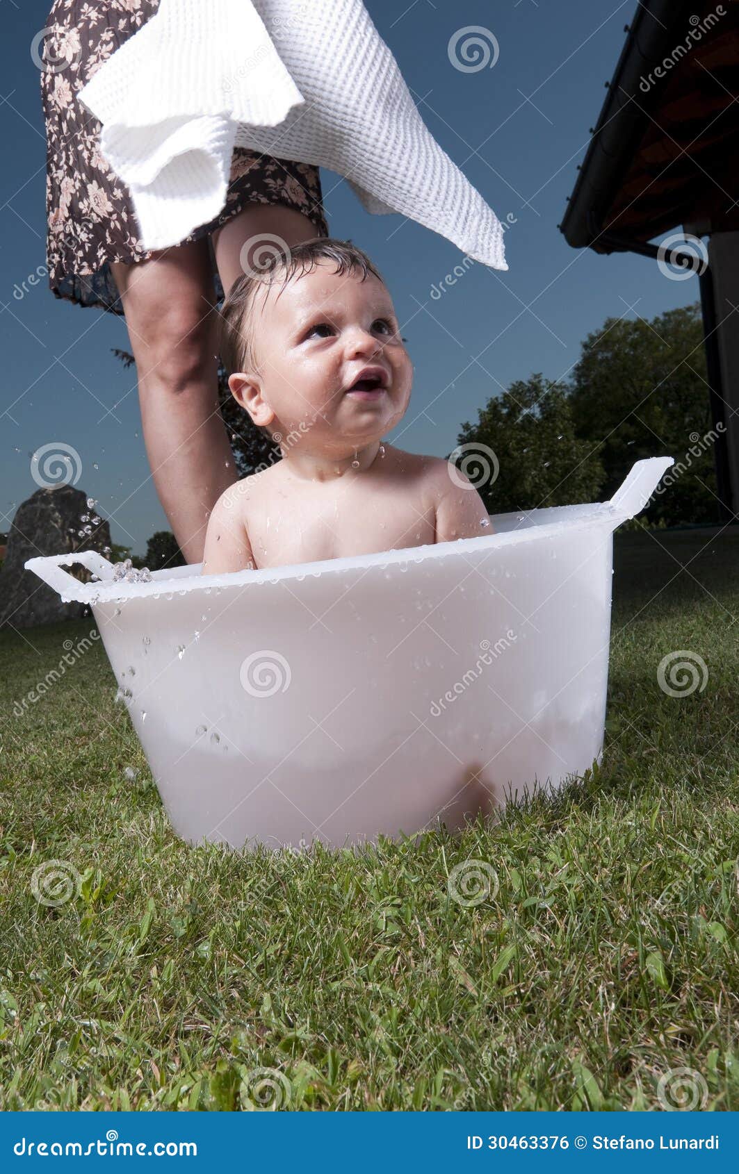 Baby having bath outdoors stock photo. Image of mother - 30463376