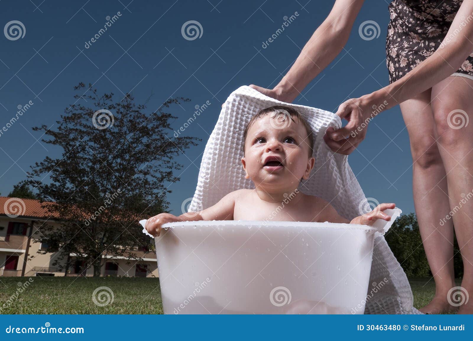 Baby having bath outdoors stock photo. Image of washing - 30463480
