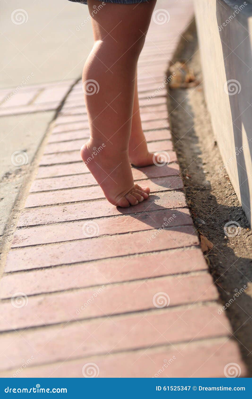 Baby on her tippy toes stock image. Image of tippytoes - 61525347