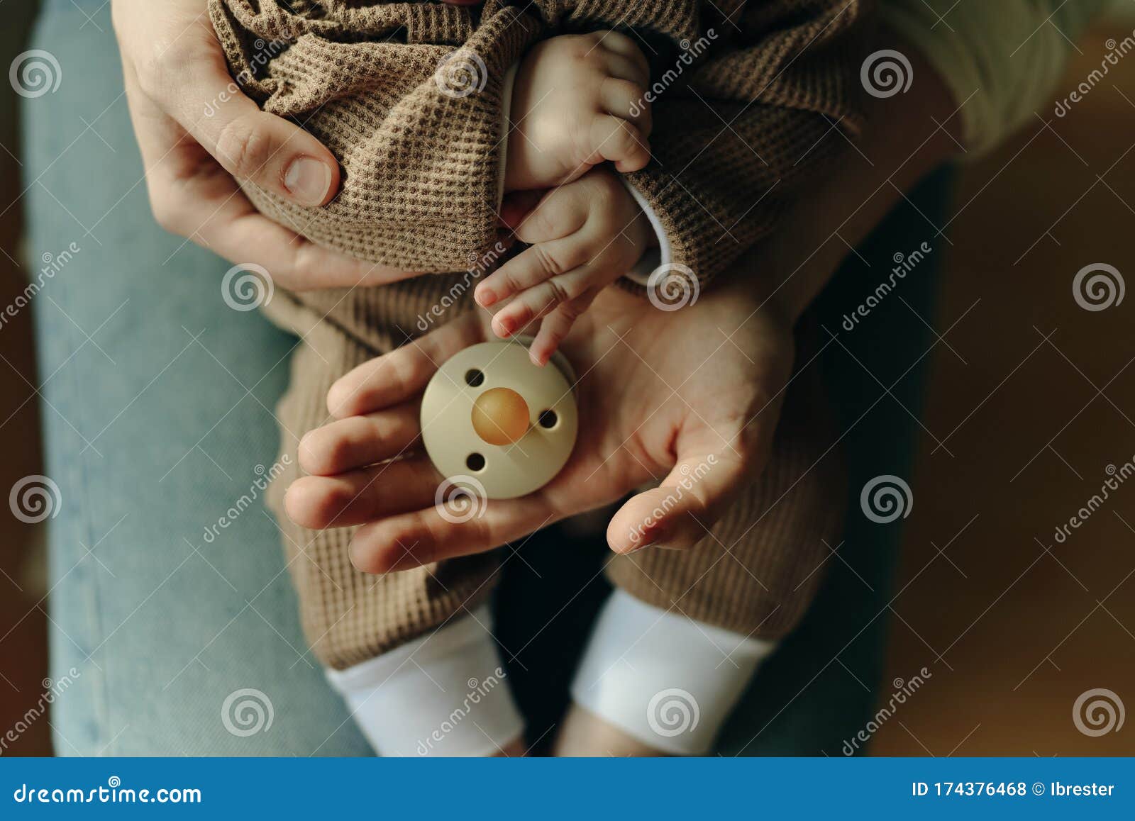 Baby Holds a Pacifier in His Mother Arms Stock Photo - Image of holds ...