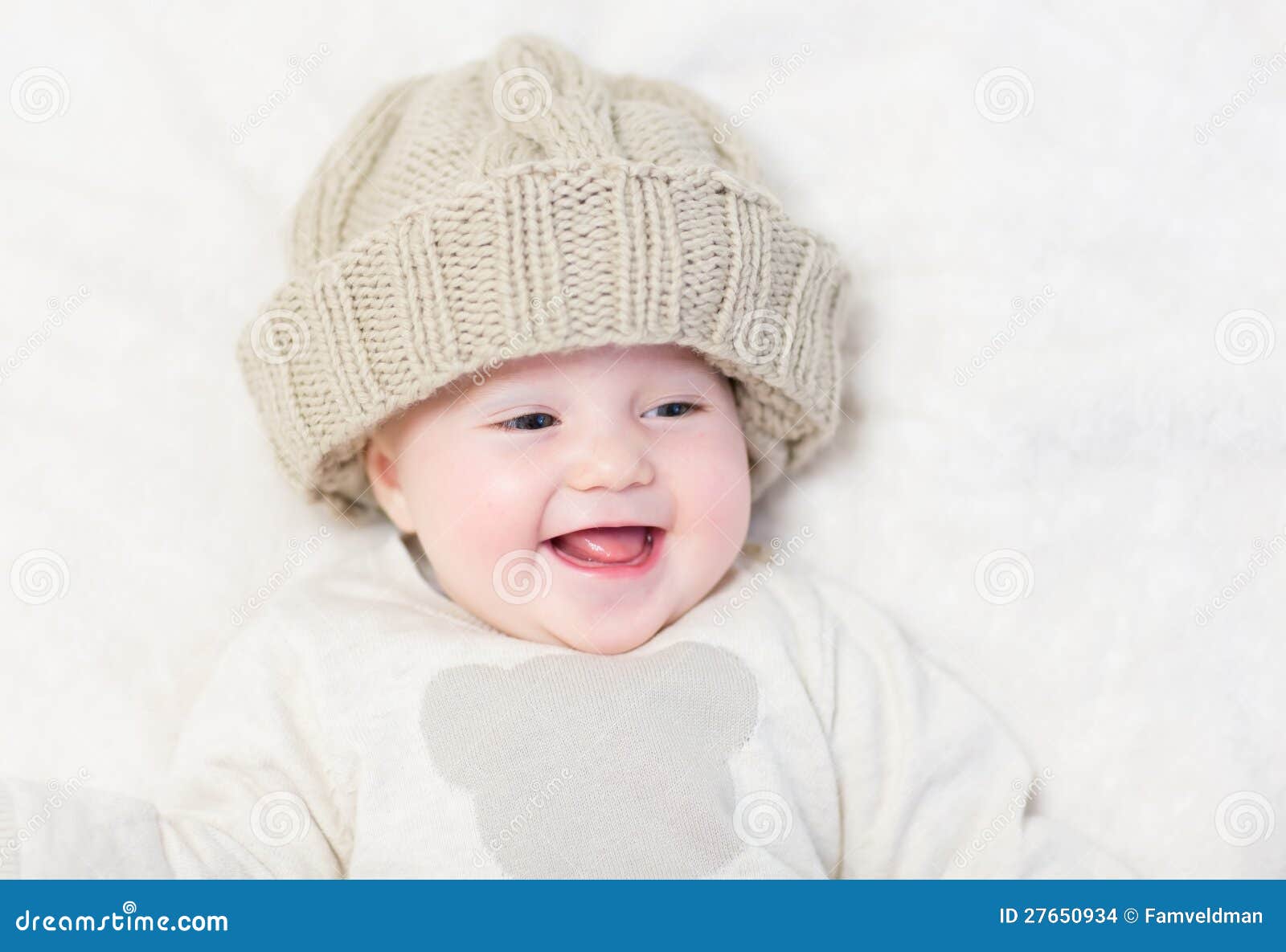 Baby in a huge knitted hat stock photo. Image of bear - 27650934