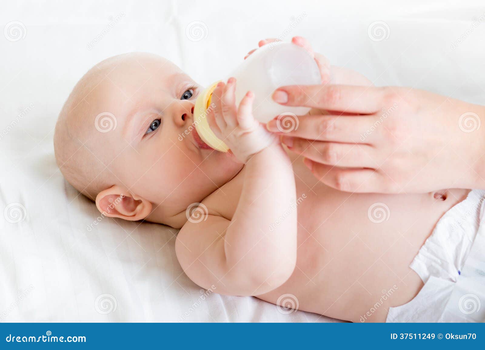 Baby infant eating milk stock image. Image of hold, family - 37511249
