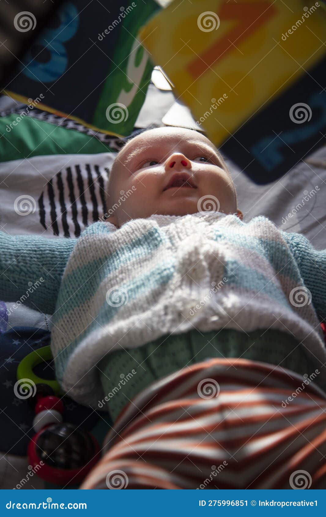 A Baby Interacting with a Developmental Sensory Activity Playmat Stock ...