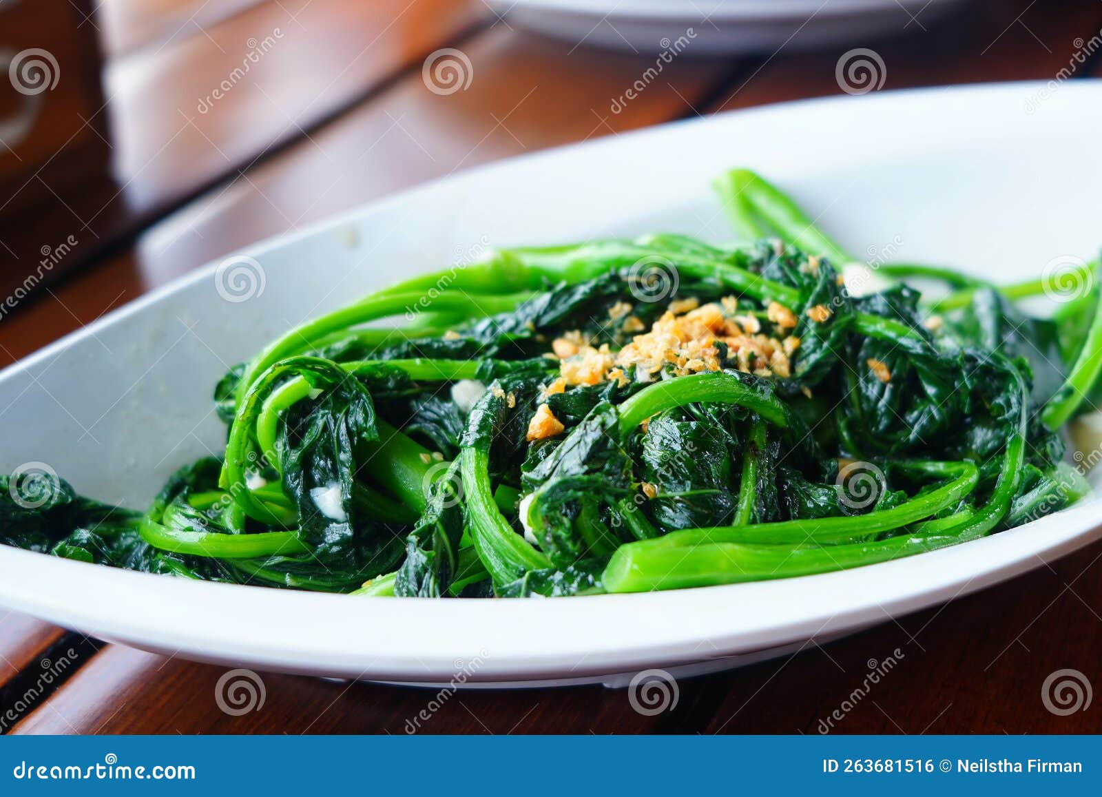 Baby Kailan Sauted in Ceramic Serving Plate Stock Photo - Image of ...