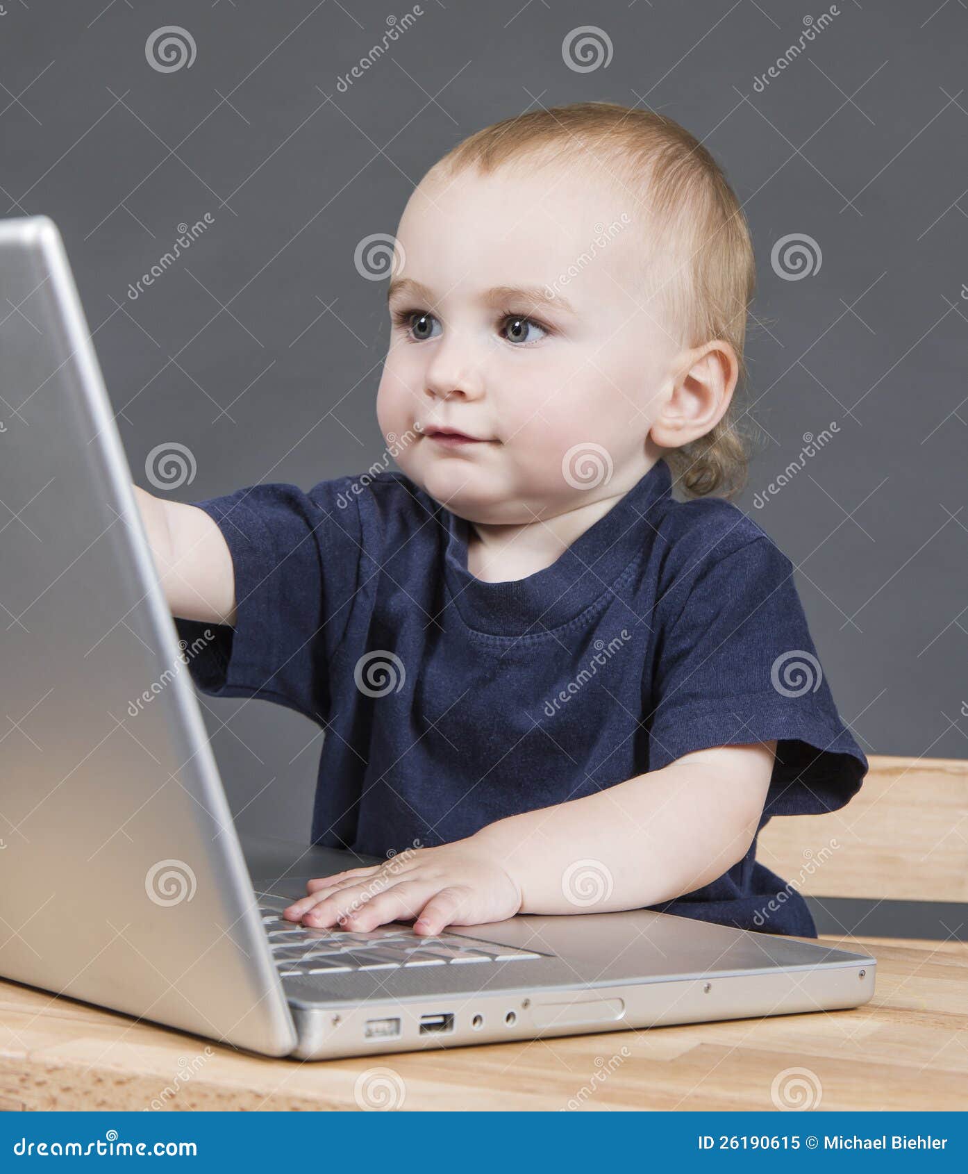 Baby with Laptop Computer in Grey Background Stock Image - Image of ...