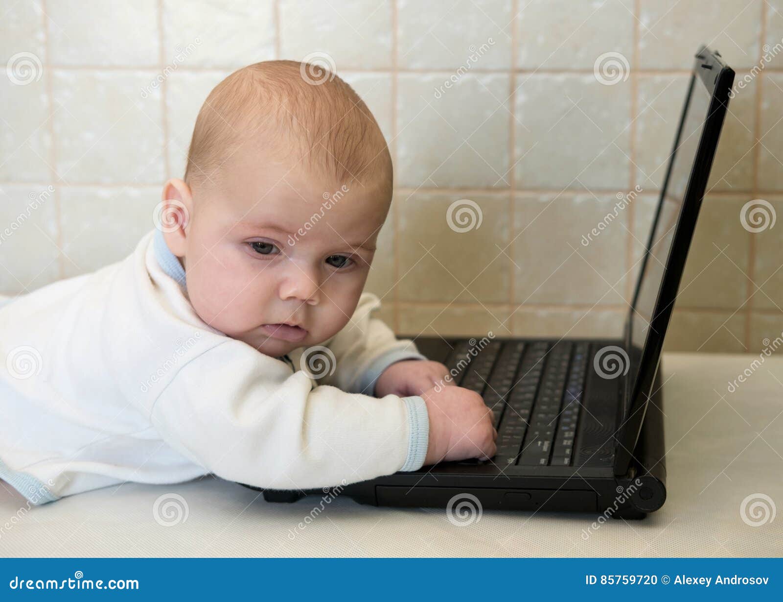 Baby with laptop stock photo. Image of charming, simulation - 85759720