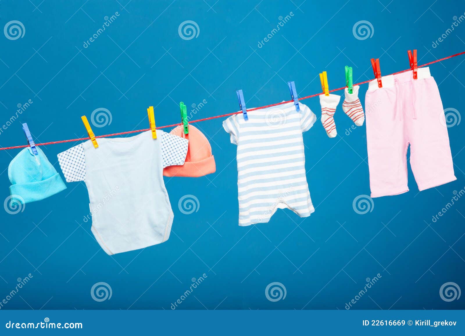 Baby Laundry Hanging On A Clothesline In Garden Stock Photo ...