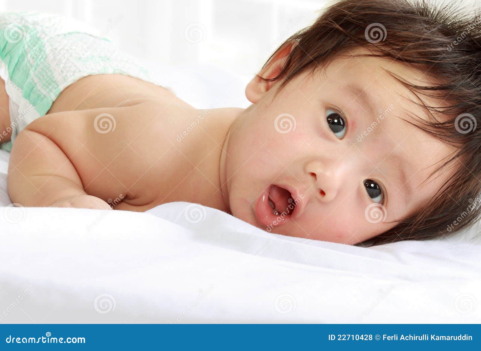 Baby laying in the bed. stock photo. Image of purity - 22710428