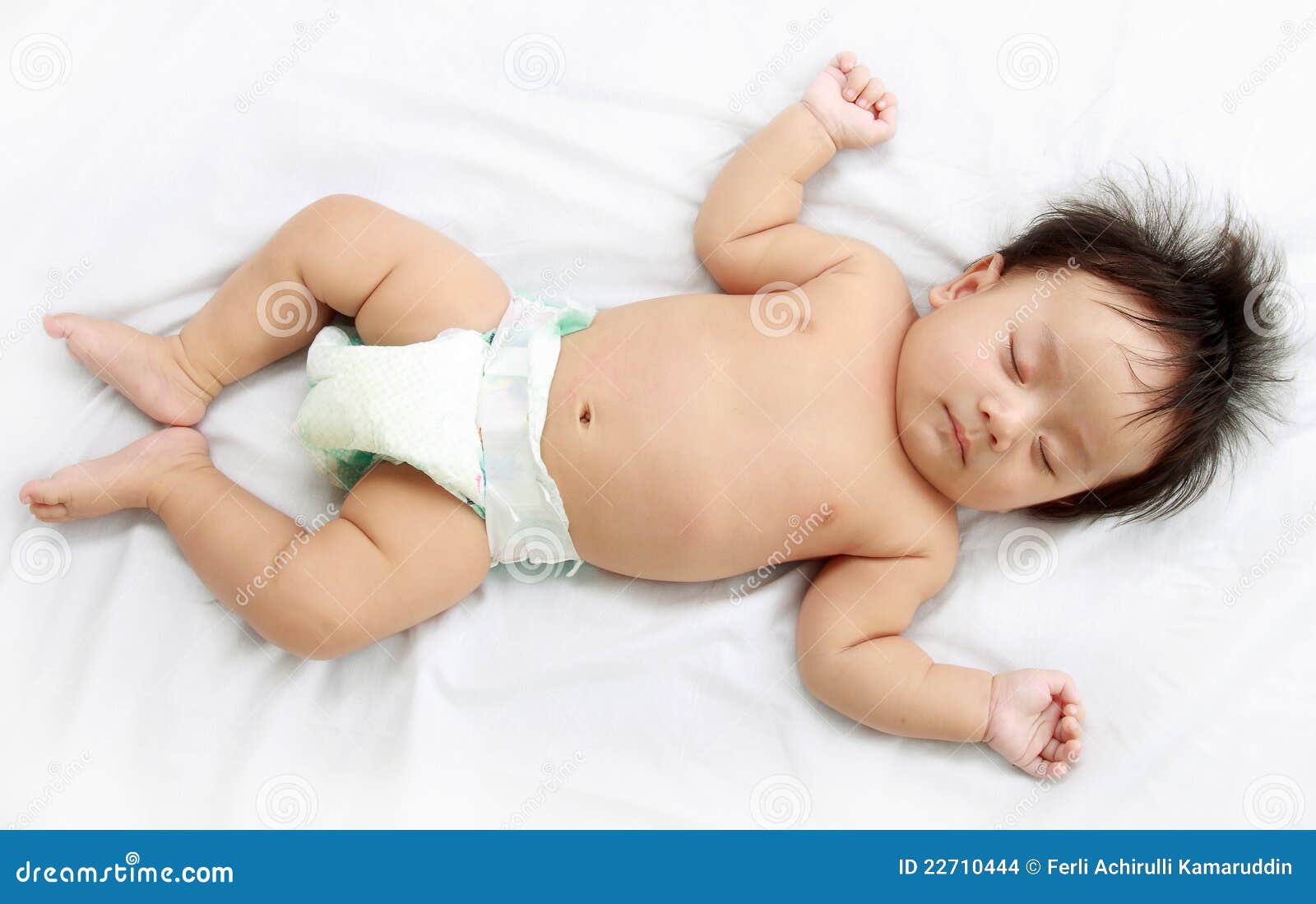 Baby laying in the bed. stock photo. Image of fabric - 22710444